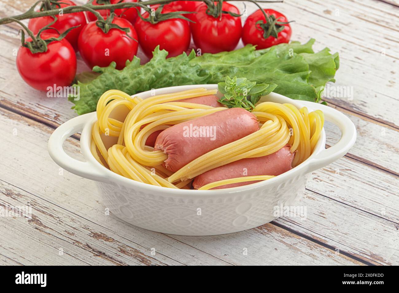 Mini sausages with pasta spaghetti for kids Stock Photo - Alamy