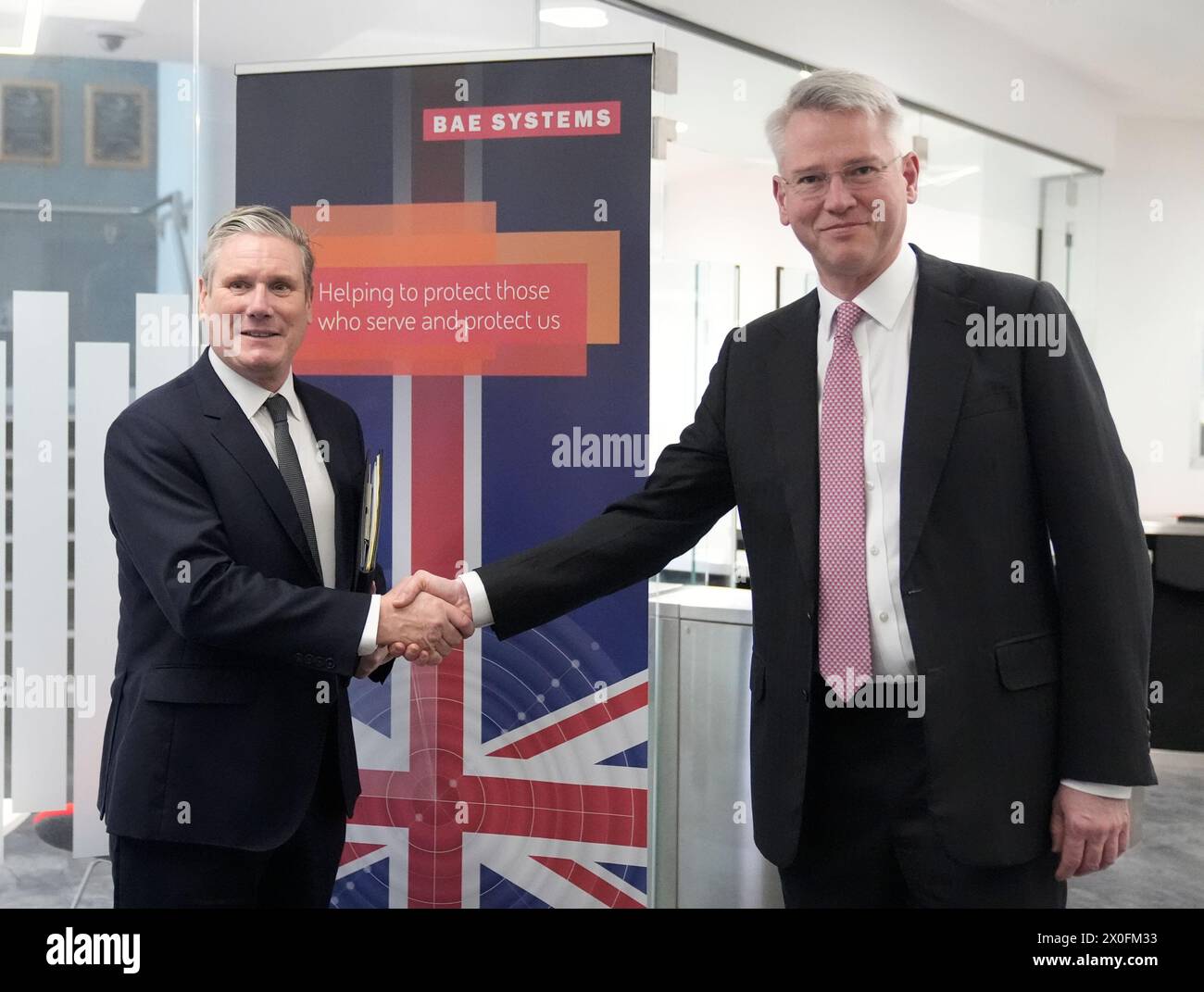 Labour Party leader Sir Keir Starmer (left) is greeted by Charles Woodburn CEO of BAE Systems ...