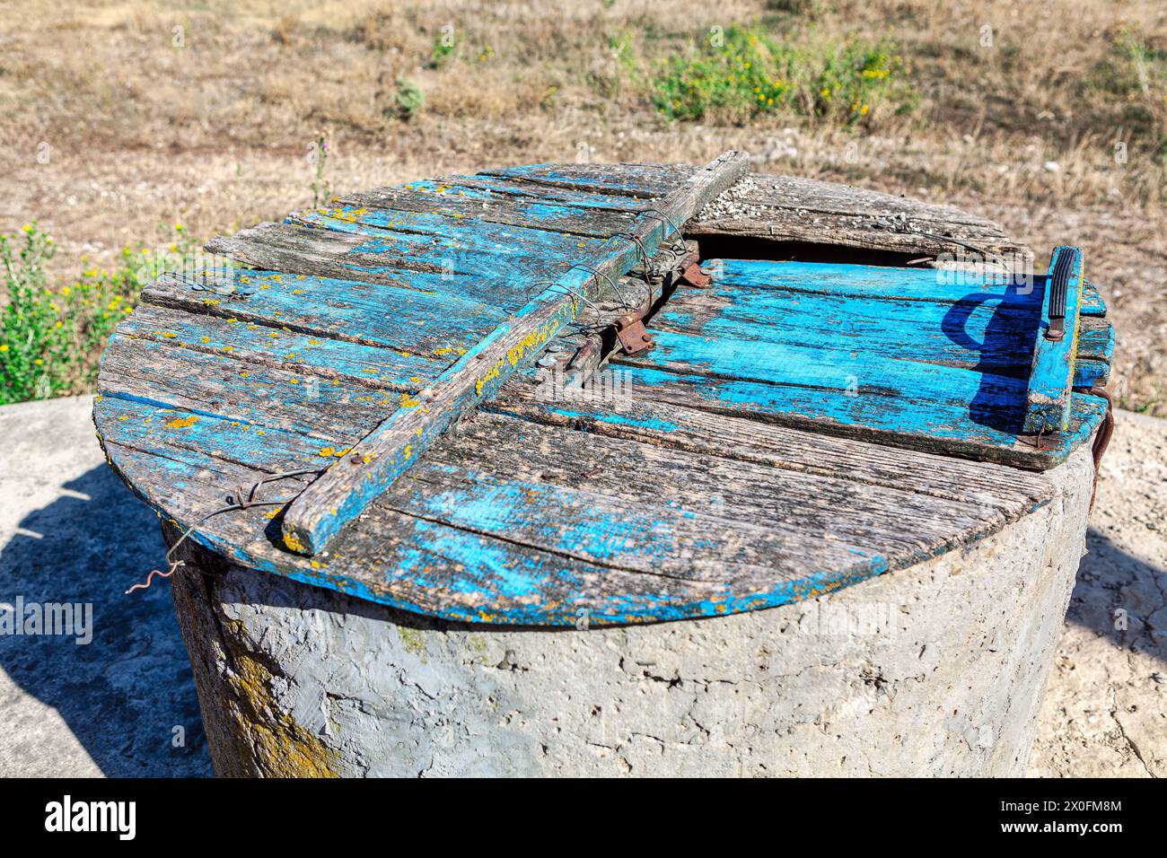 Ancient water well covered with wooden cap Stock Photo - Alamy