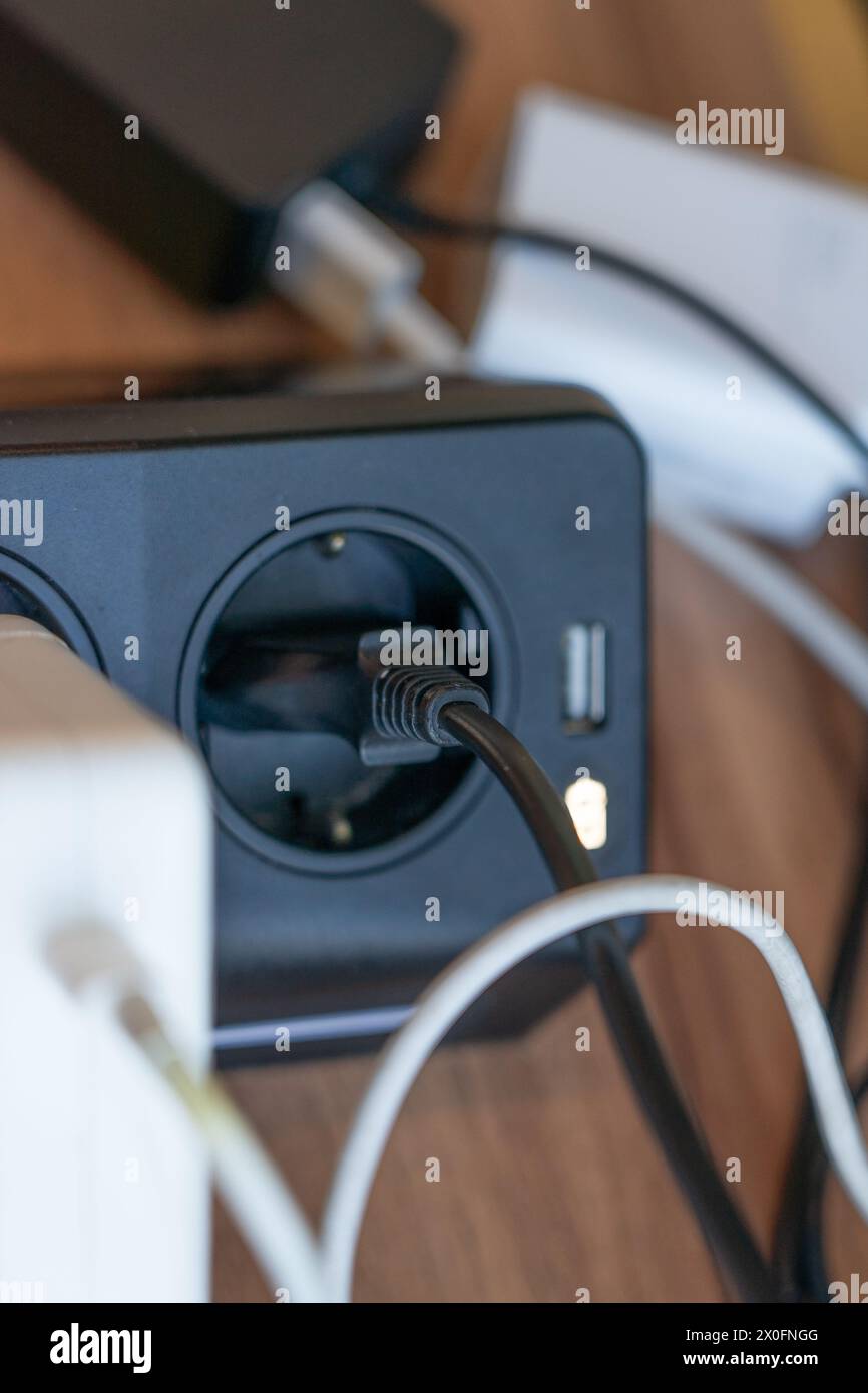 Plug plugged into electricity. Save electricity Stock Photo - Alamy