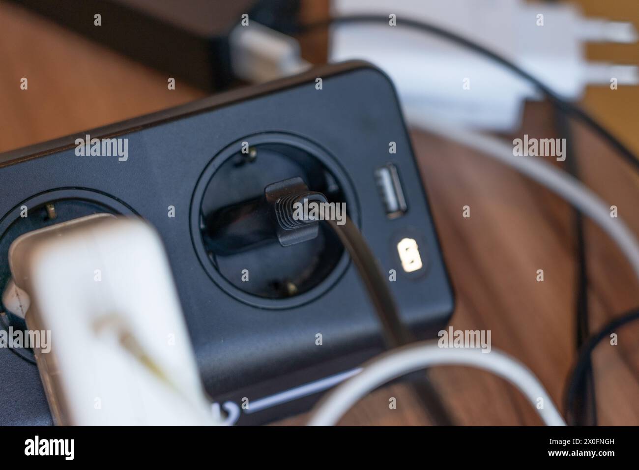 Plug plugged into electricity. Save electricity Stock Photo - Alamy