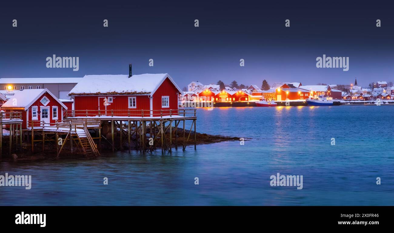 Scenic night lights of Lofoten islands, Norway, Reine and red houses in ...