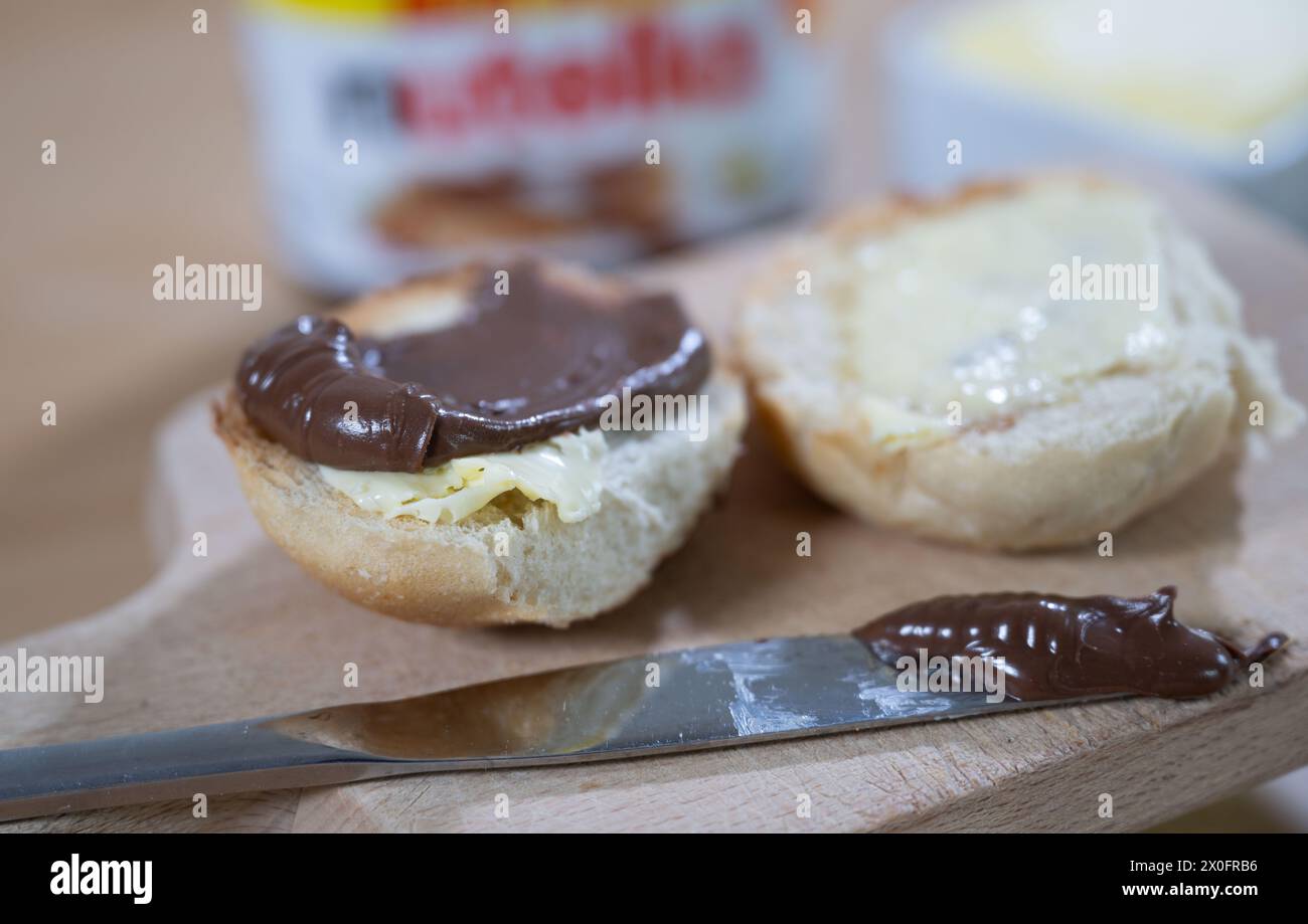 ILLUSTRATION - 10 April 2024, Saxony, Leipzig: A roll with Nutella lies ...