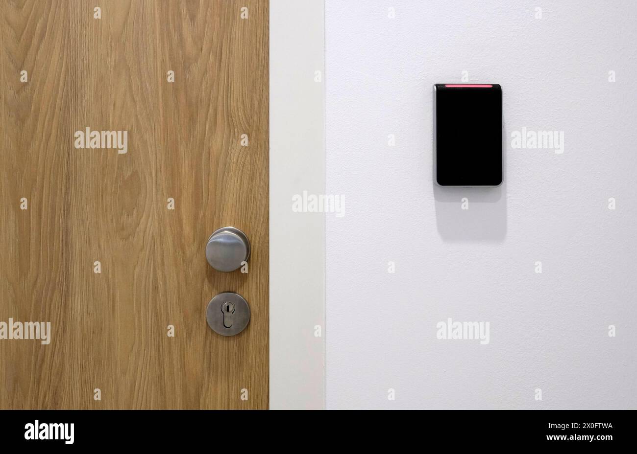 Locked door with digital access control Stock Photo - Alamy