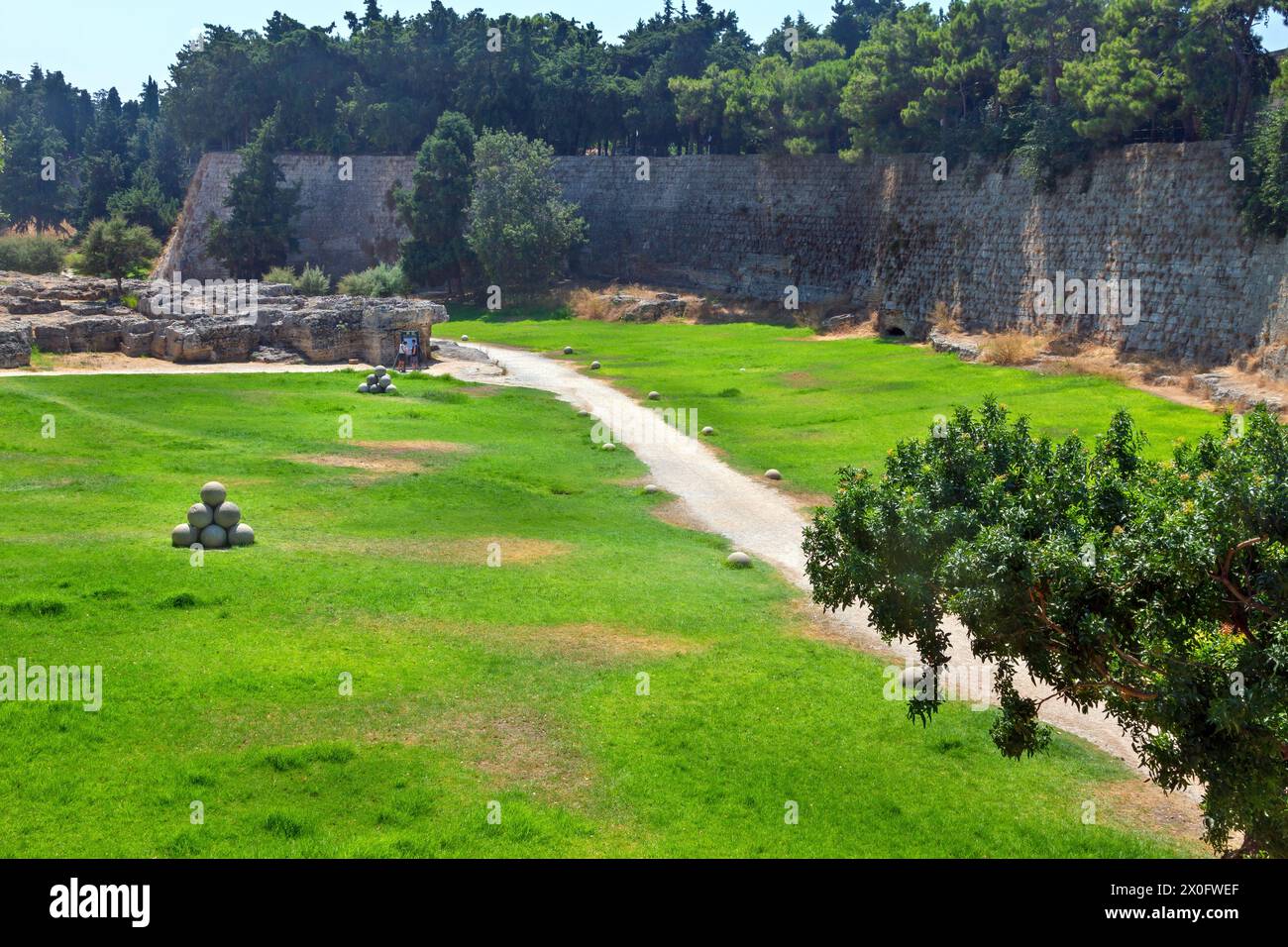 The walls and the ditch of the Grand Master Palace, with some medieval ...