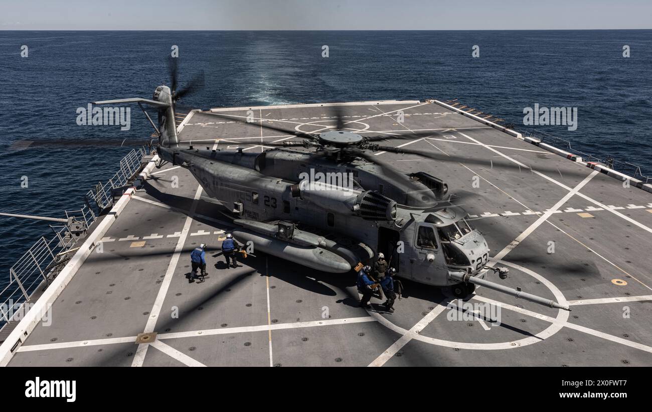 U.S. Navy Sailors with the USS New York (LPD 21) secure a CH-53E Super ...