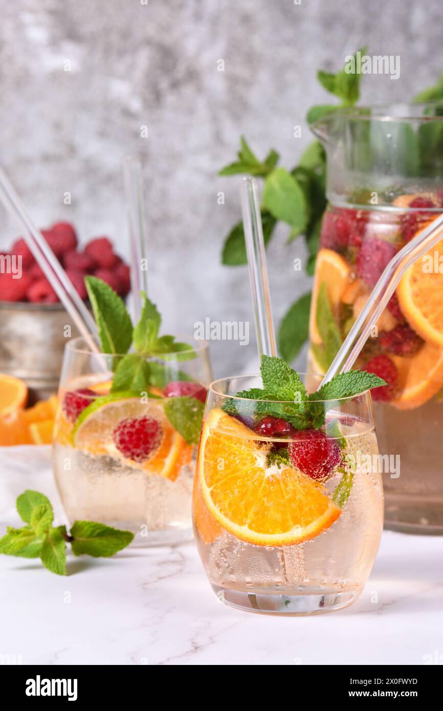 Summer Sangria cocktail or lemonade with raspberry, orange and mint ...
