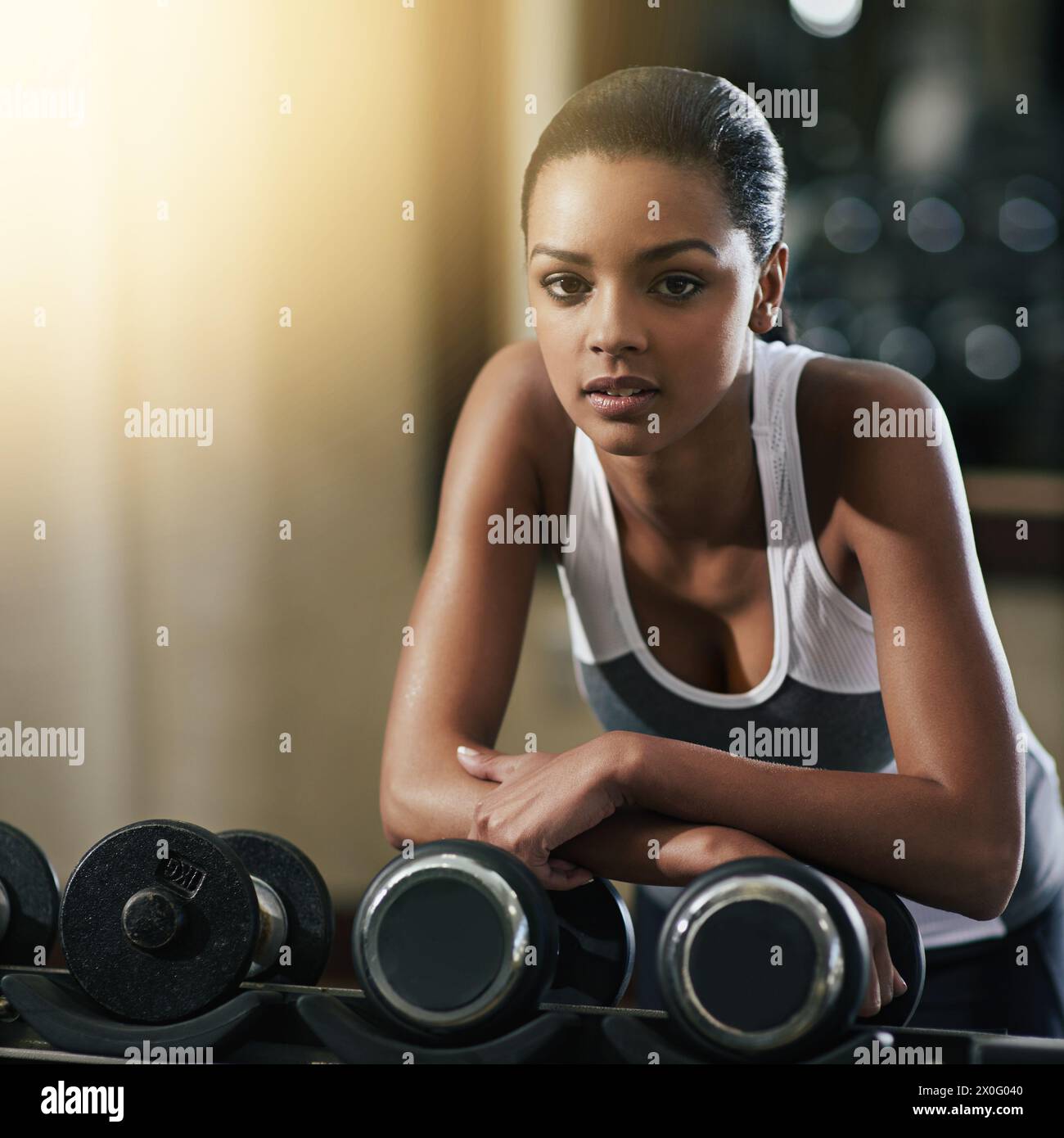 Fitness, portrait and girl at a gym with dumbbell for training, sports ...