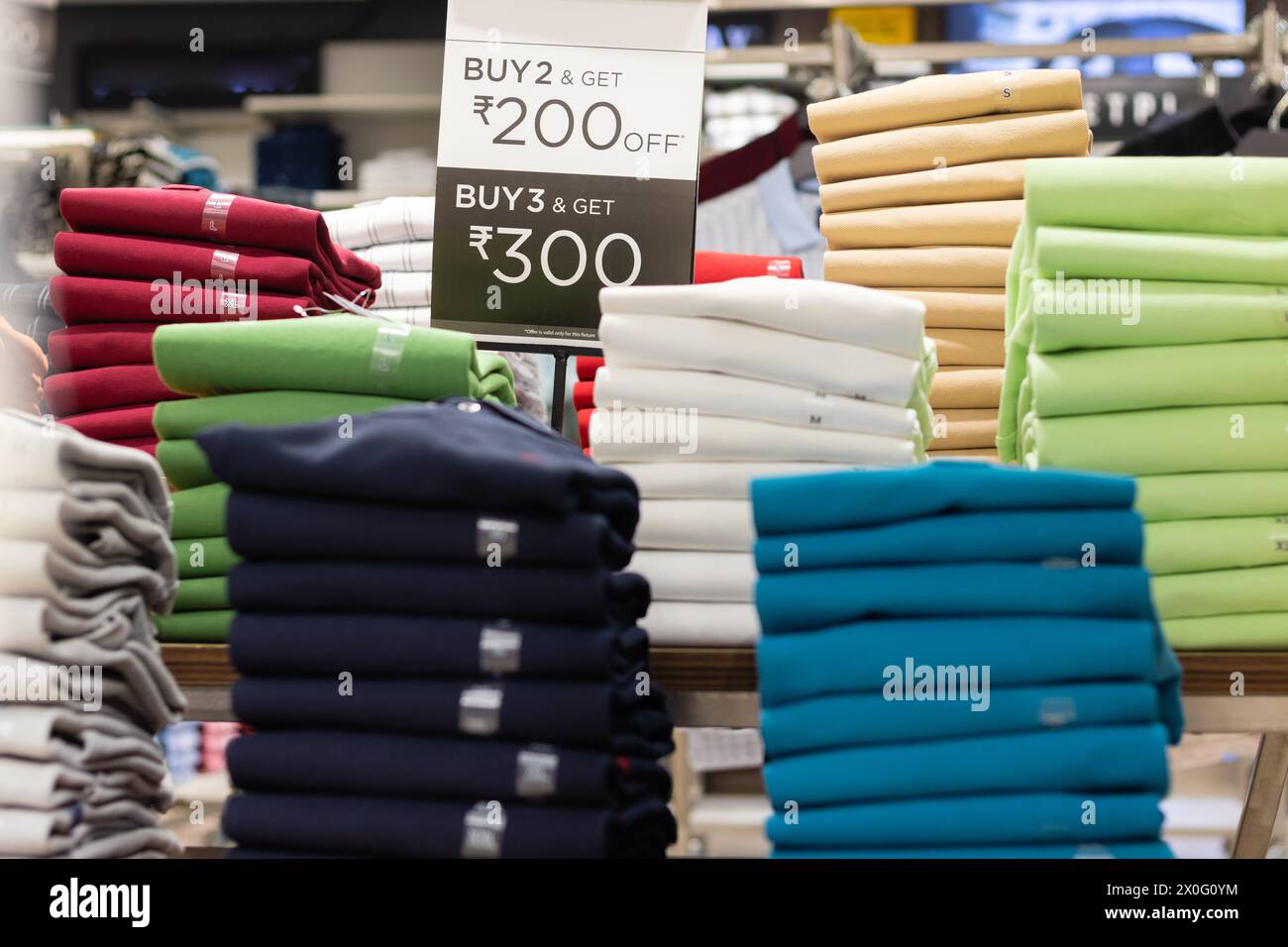 A rack in a shopping mall of India containing colorful polo t-shirts ...