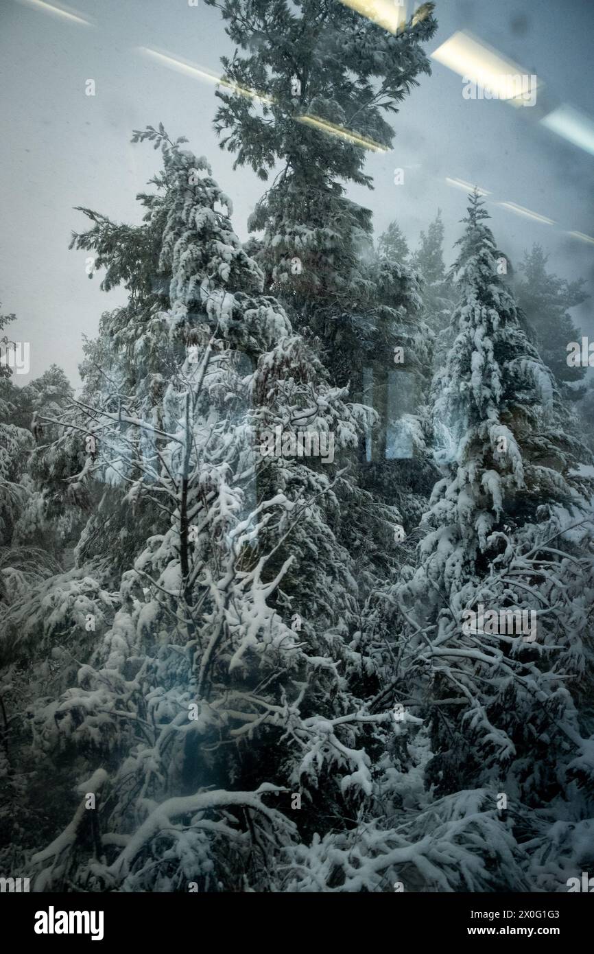 Snowy landscape seen from the train from Athens to Kalambaka crossing ...
