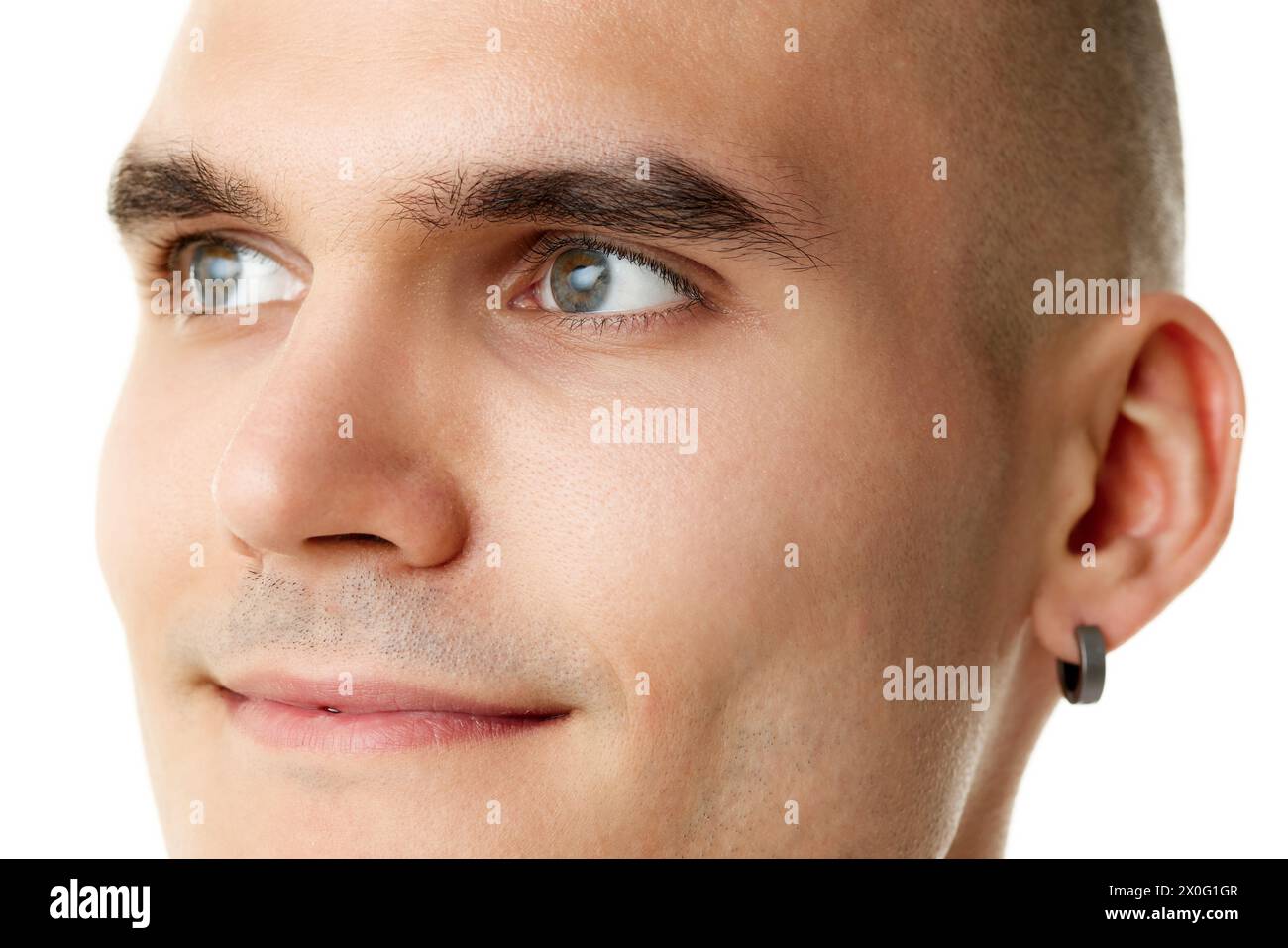 Close-up of handsome young smiling man with spotless face, thick brows ...
