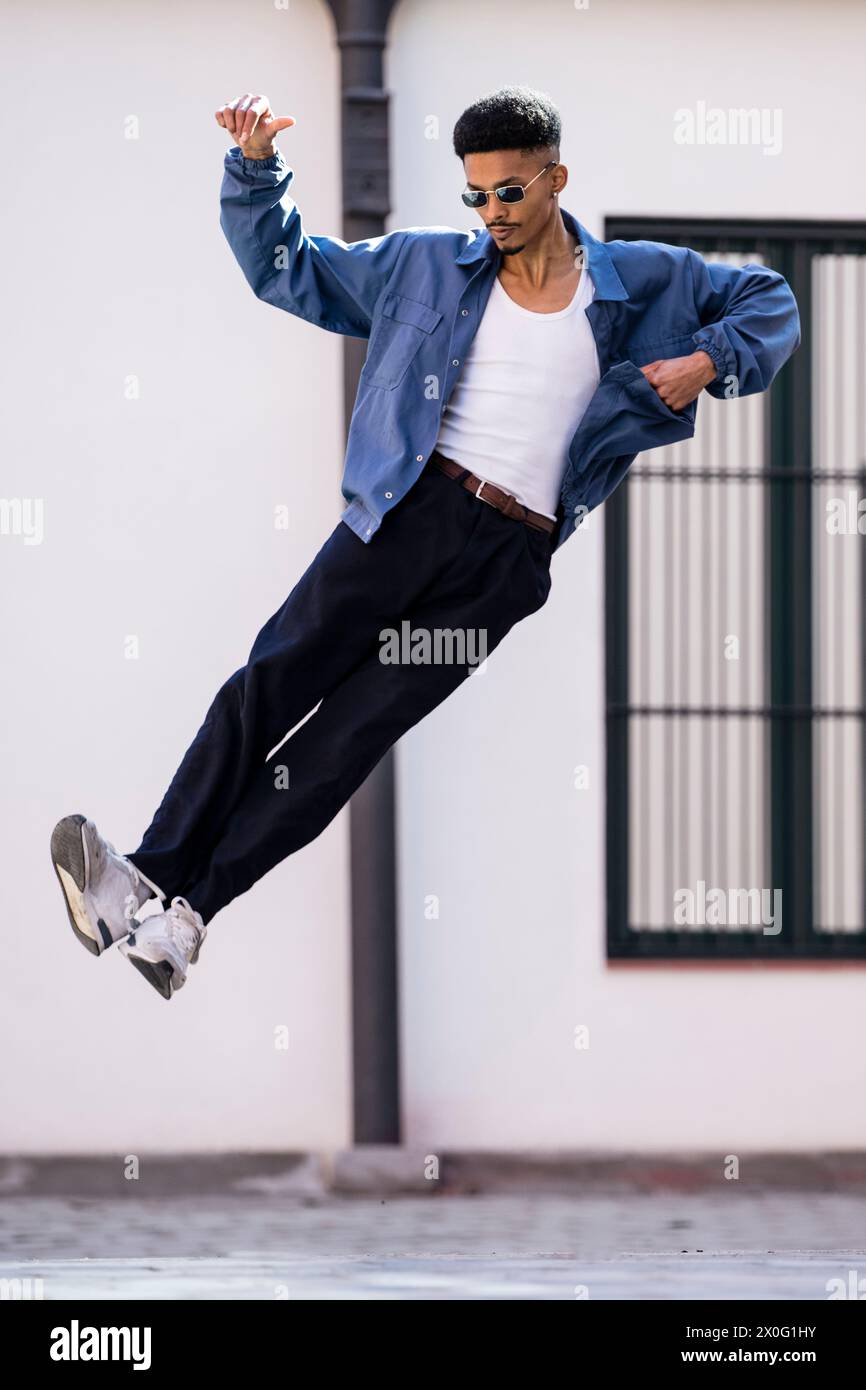 Successful confident handsome young adult jumping outside Stock Photo ...