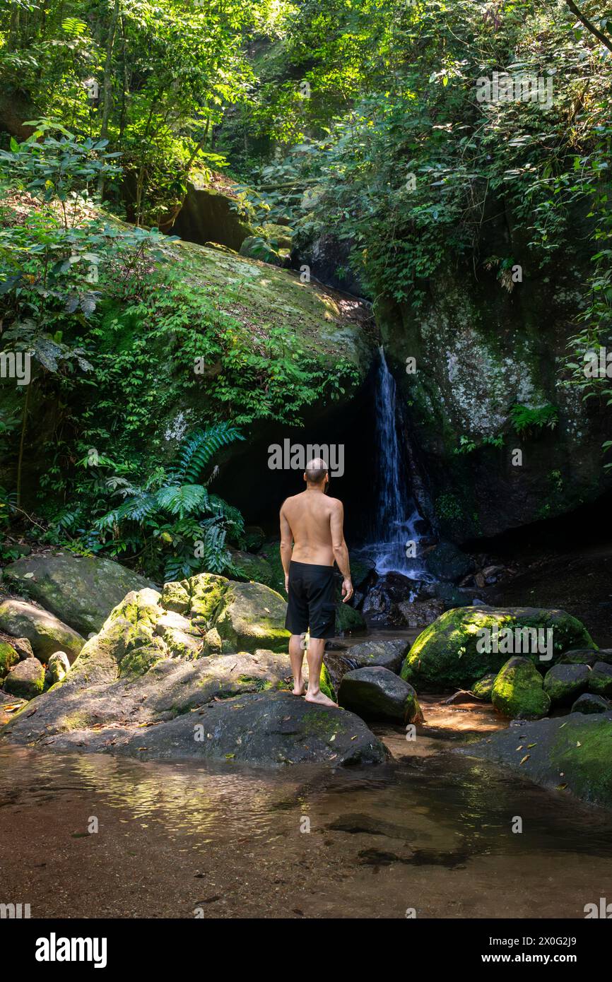 Man bathing in waterfall hi-res stock photography and images - Alamy