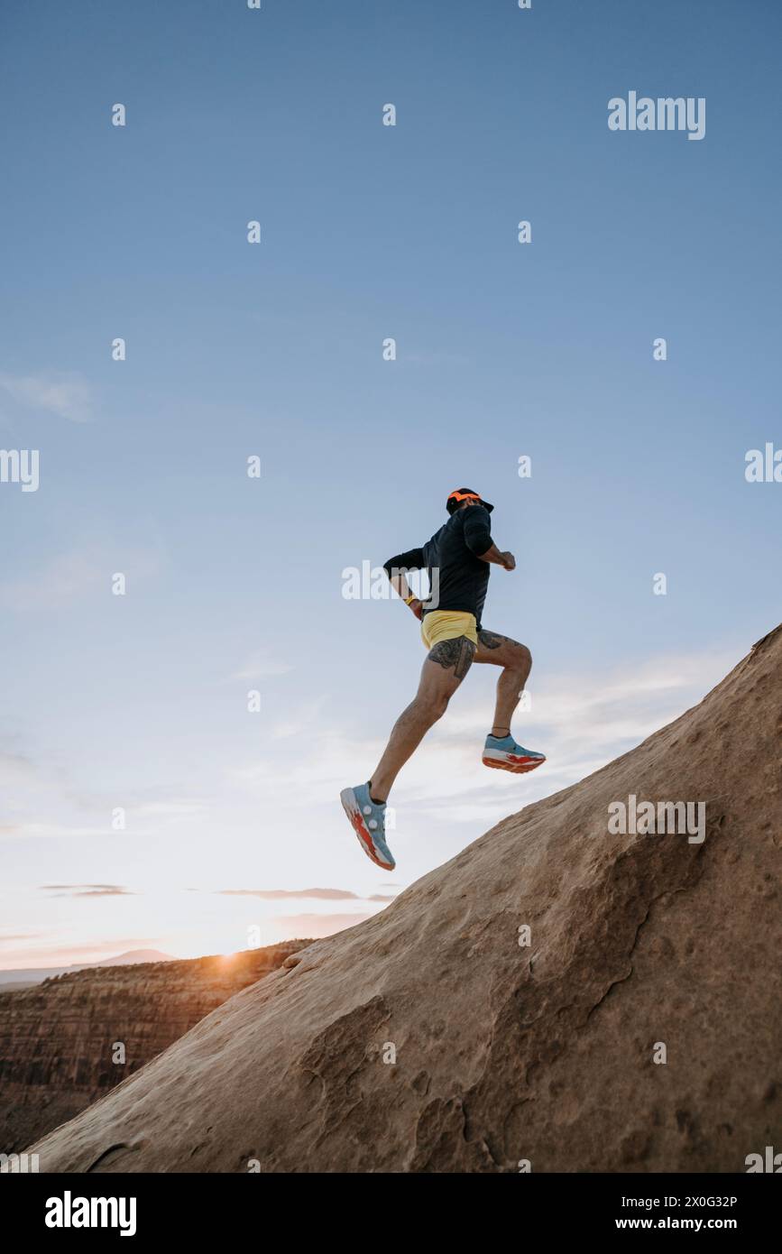 Trail runner jumping run hi-res stock photography and images - Alamy