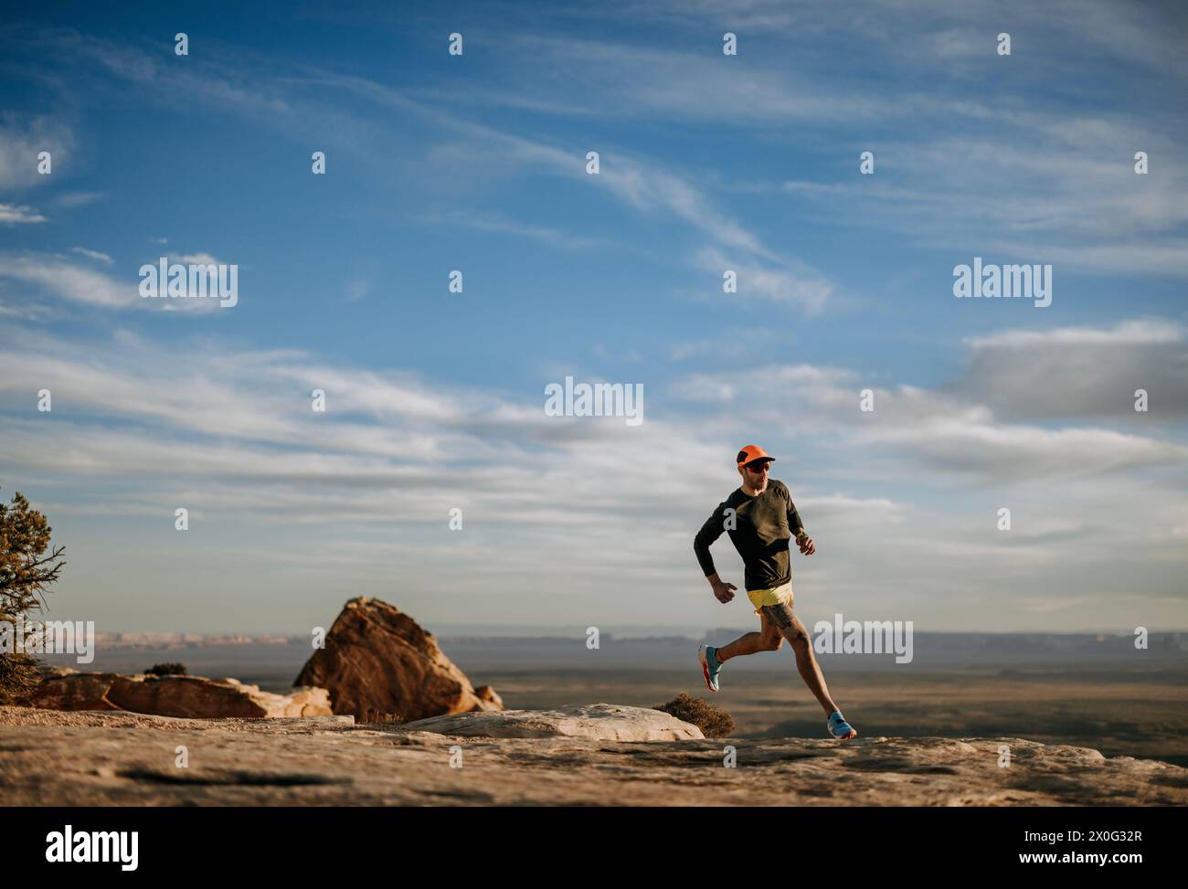 Male running through desert hi-res stock photography and images - Alamy