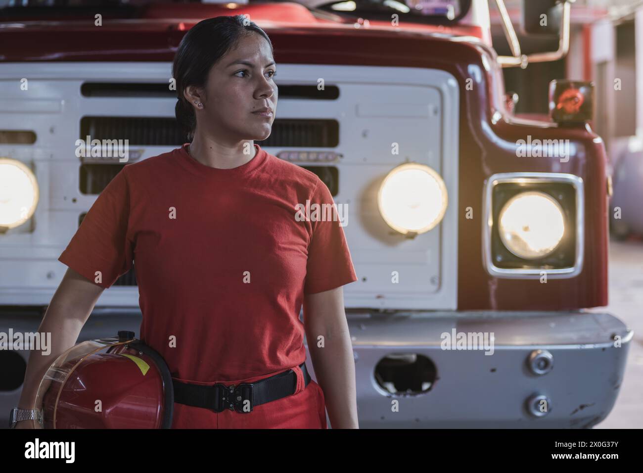 Portrait of female firefighter standing at fire station Stock Photo - Alamy