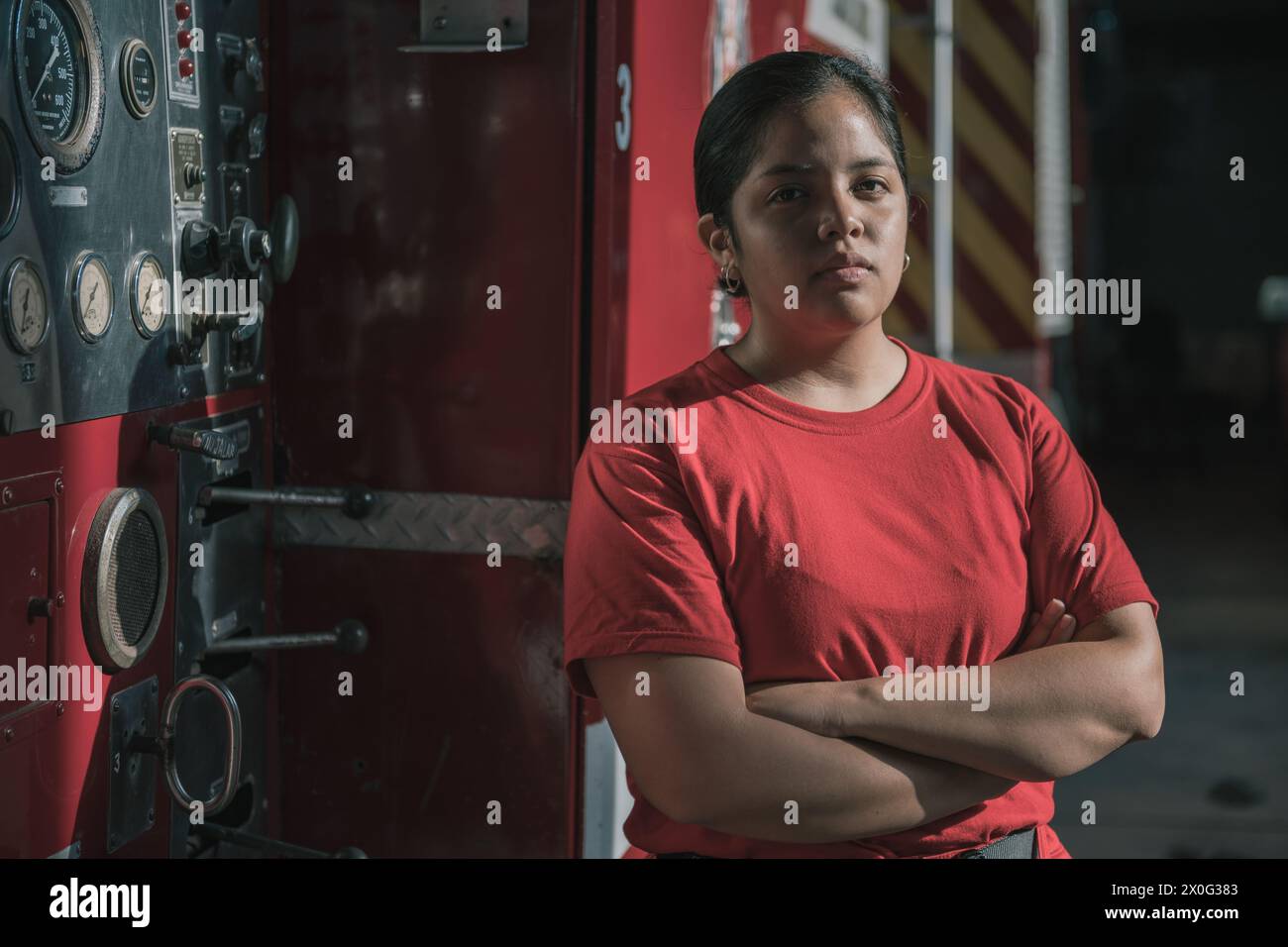 Portrait of female firefighter standing at fire station Stock Photo - Alamy