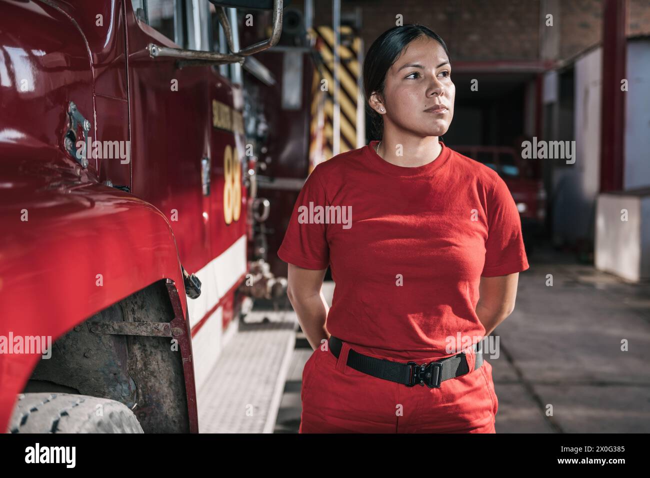 Portrait of female firefighter standing at fire station Stock Photo - Alamy