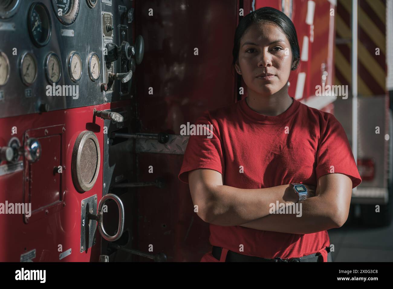 Portrait of female firefighter standing against fire engine Stock Photo ...