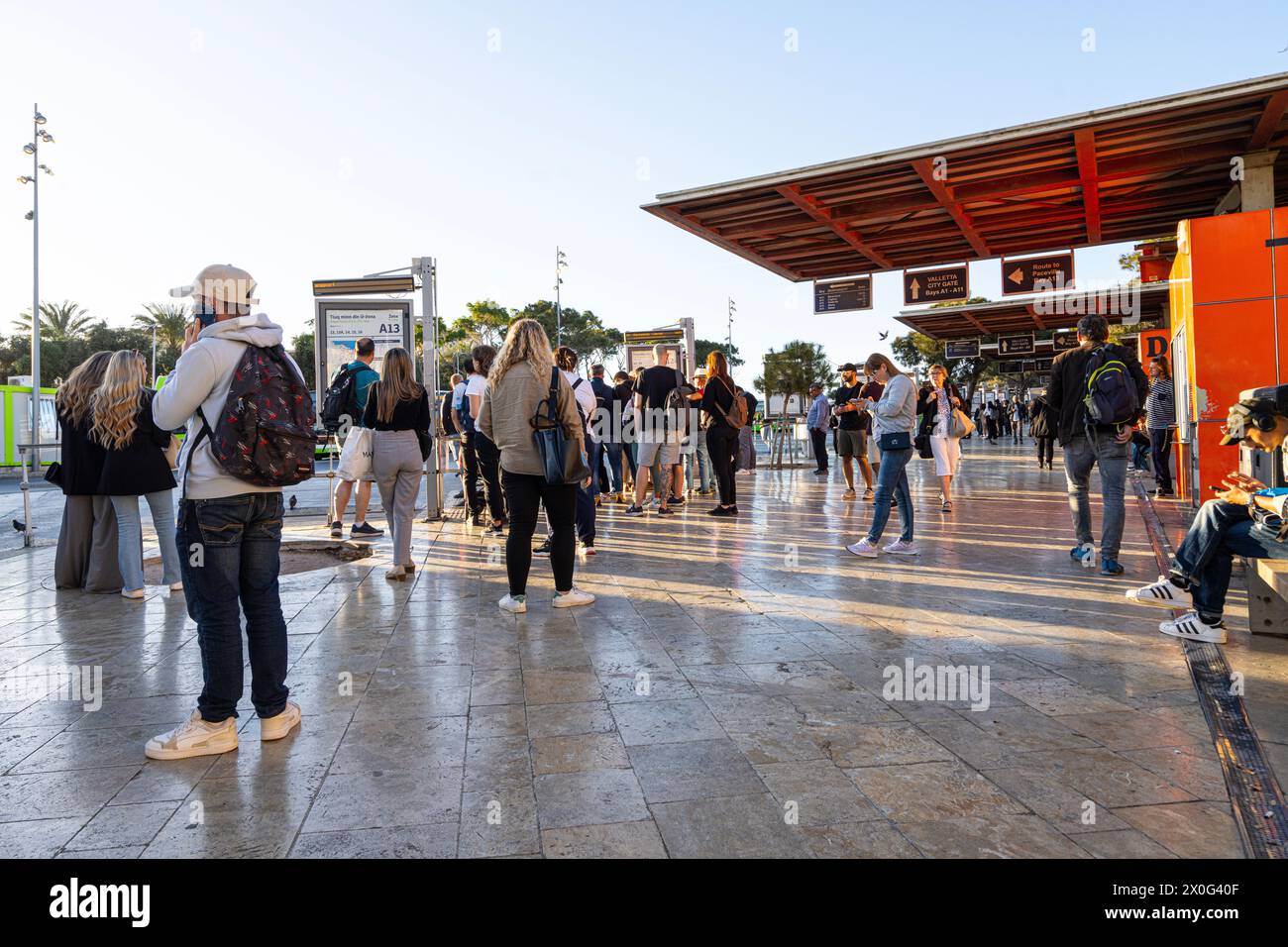 Valletta, Malta, April 03, 2024. people waiting in the bus station of ...