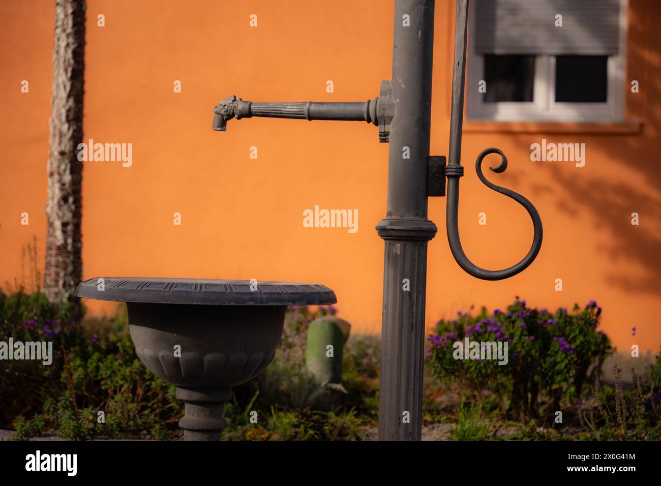 Traditional stand-up fountain on the roadside in Stuttgart Zuffenhausen ...