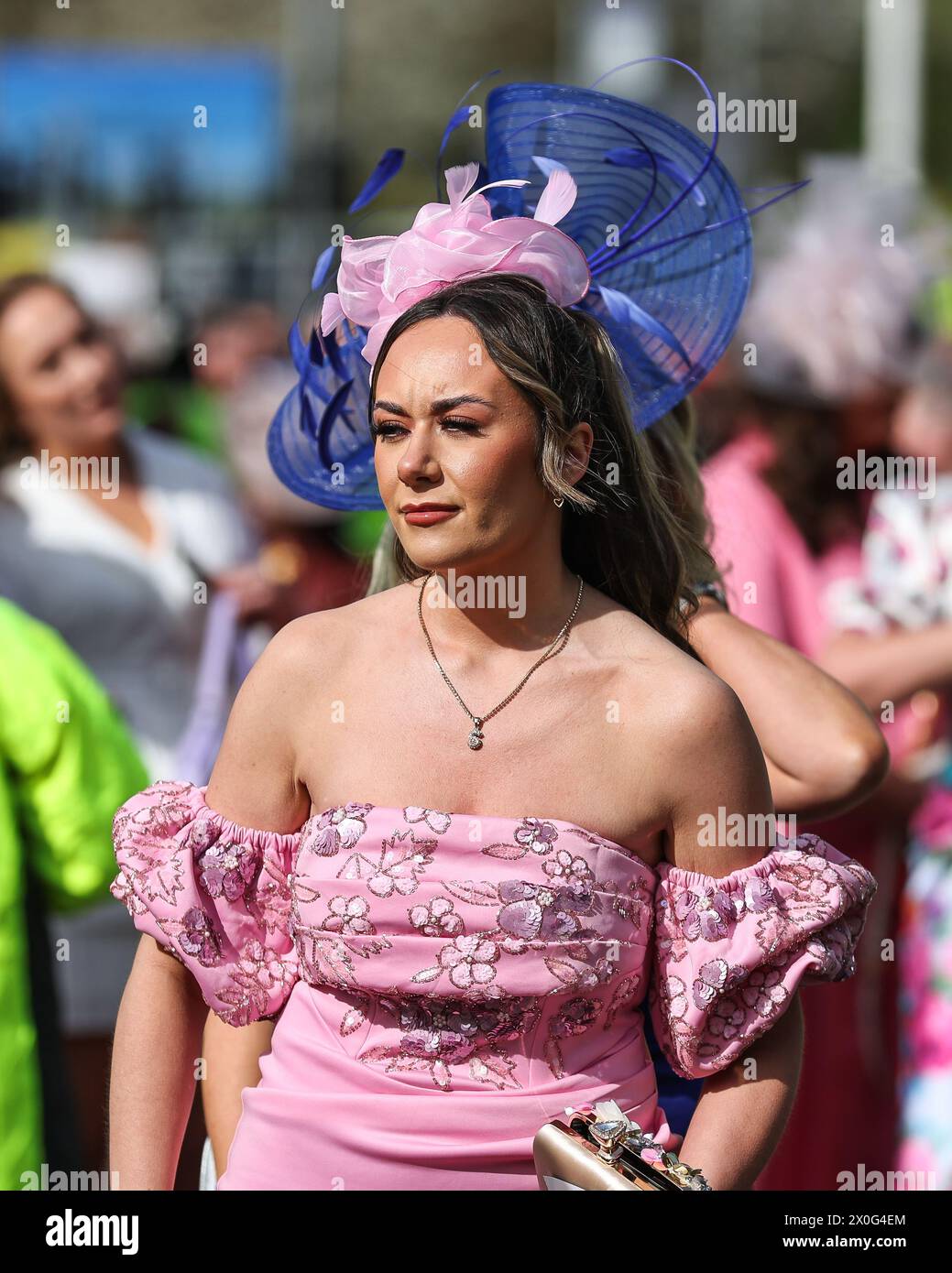 Racegoers arrive on ladies day at during the The Randox Grand National ...