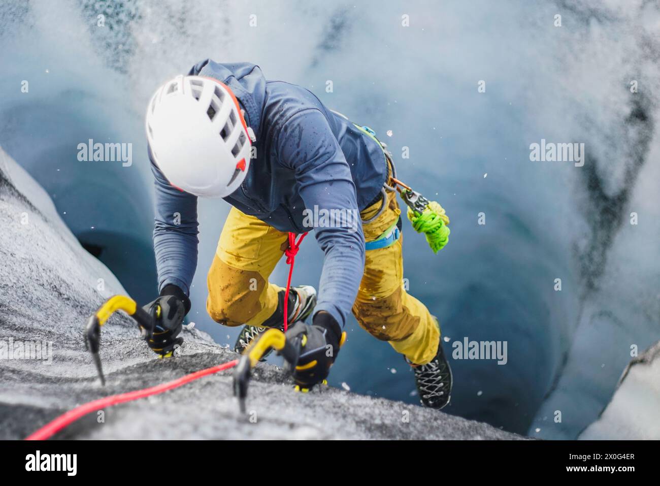 Man climbing glacier crevasse hi-res stock photography and images - Alamy