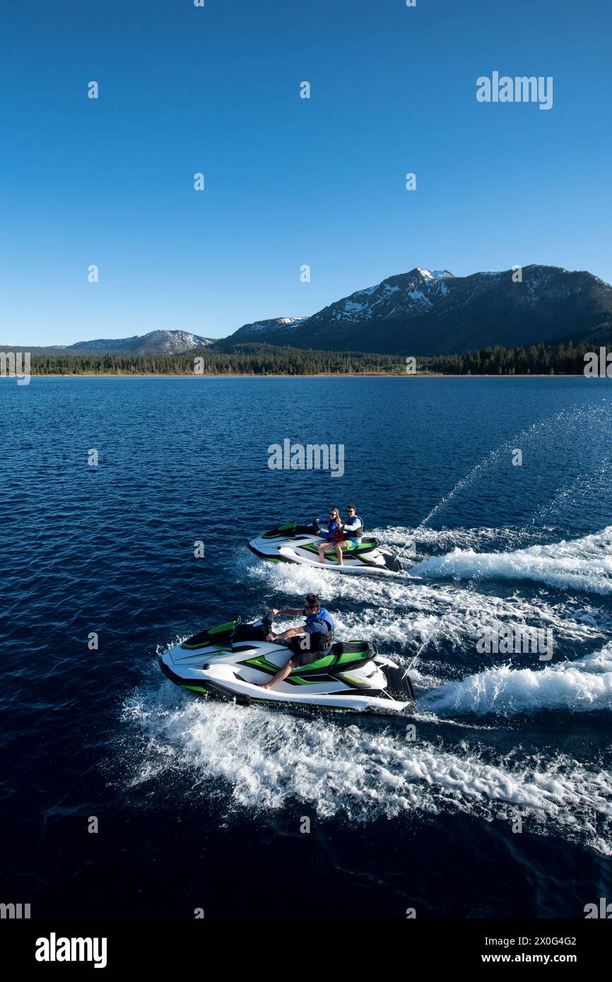 Three friends ride WaveRunners on Lake Tahoe, California Stock Photo ...