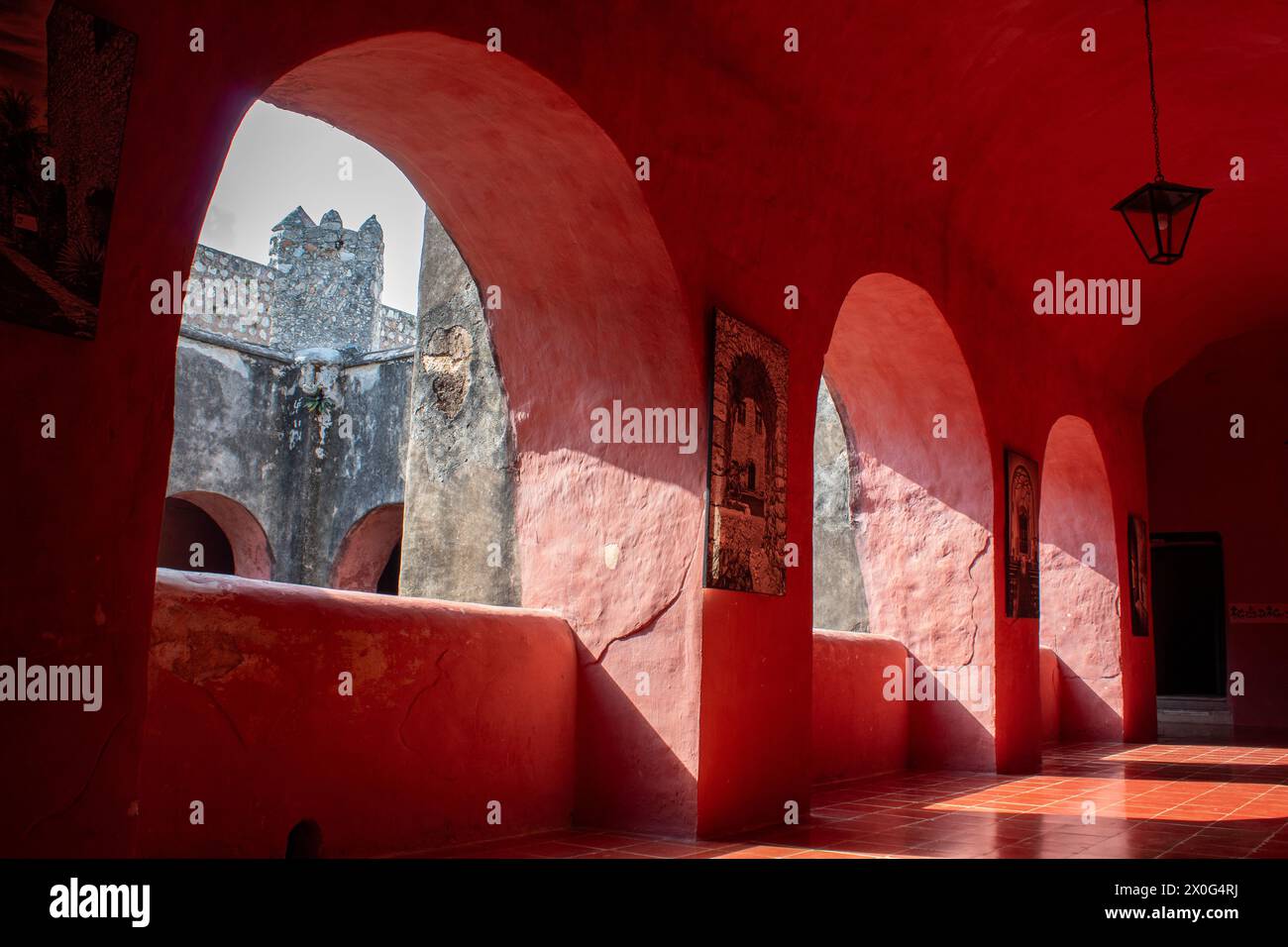 Interior hallway of a convent with pink walls Stock Photo - Alamy
