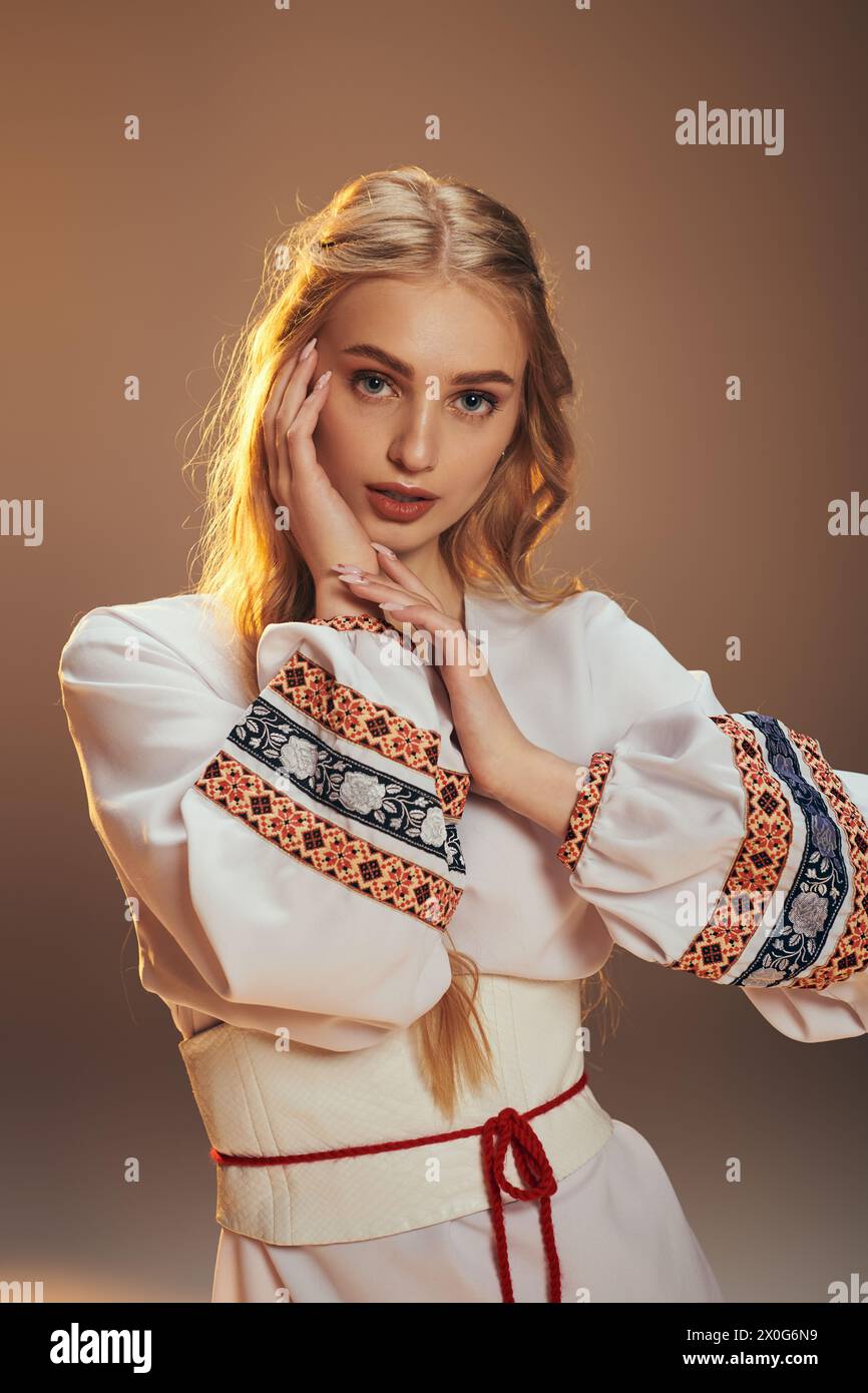 A young woman in a white dress strikes a graceful pose in a fairy tale ...