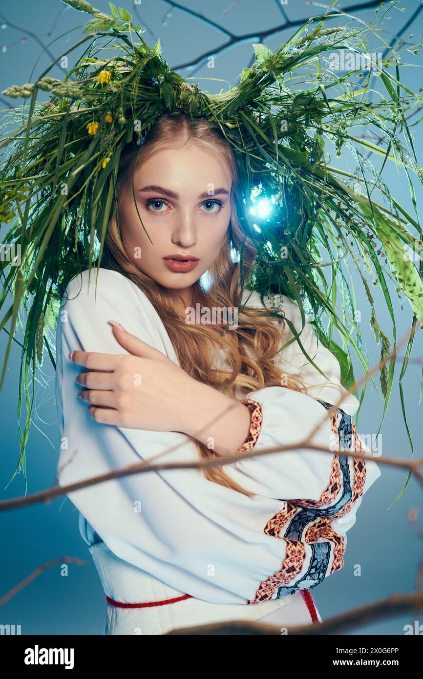 A young woman in a traditional outfit adorned with an ornate wreath in ...