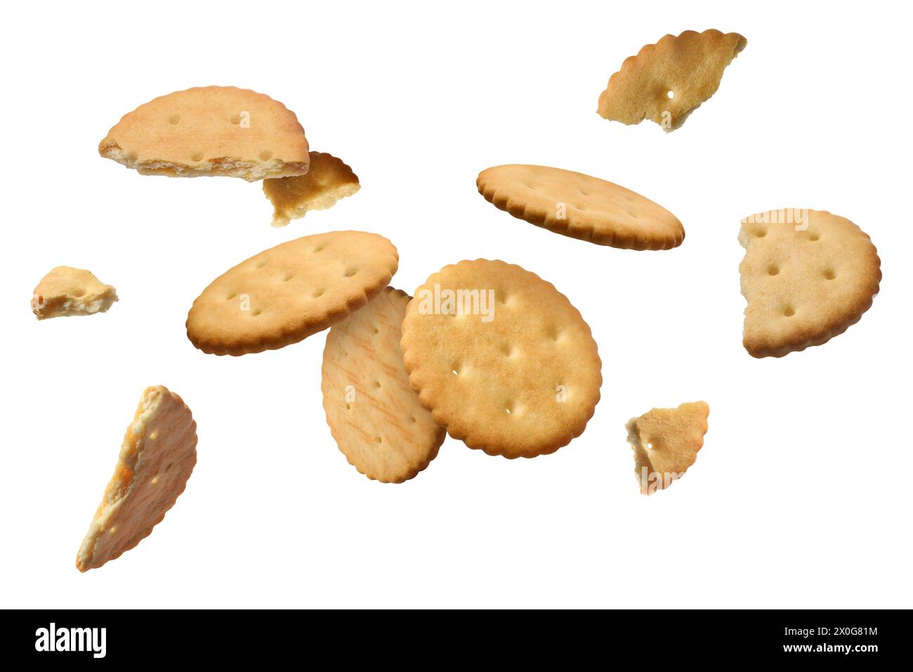 Tasty dry crackers falling on white background Stock Photo - Alamy
