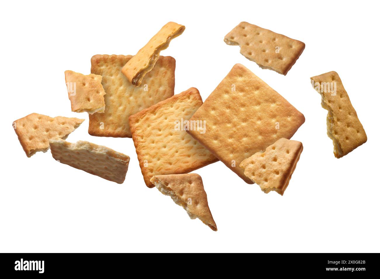 Tasty dry crackers falling on white background Stock Photo - Alamy