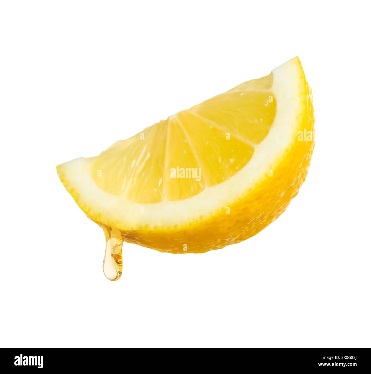 Juice dripping from slice of lemon isolated on white Stock Photo - Alamy