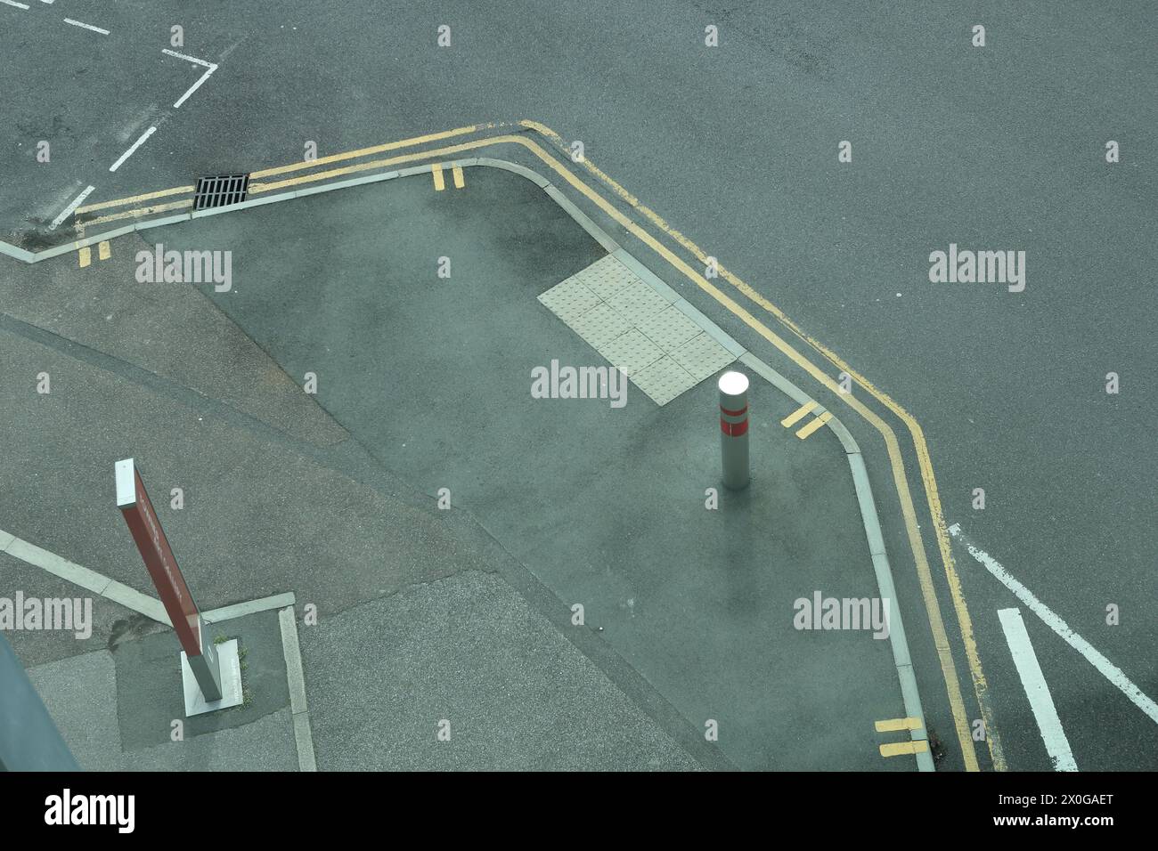 Road markings and pavement with kerb white lines and yellow lines ...