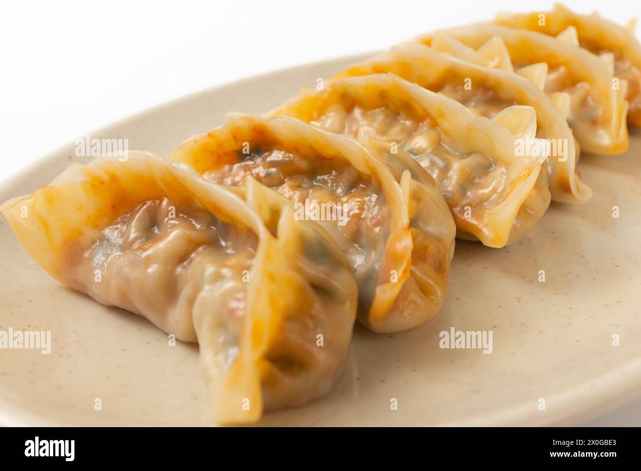 Kimchi dumplings on a white background Stock Photo - Alamy