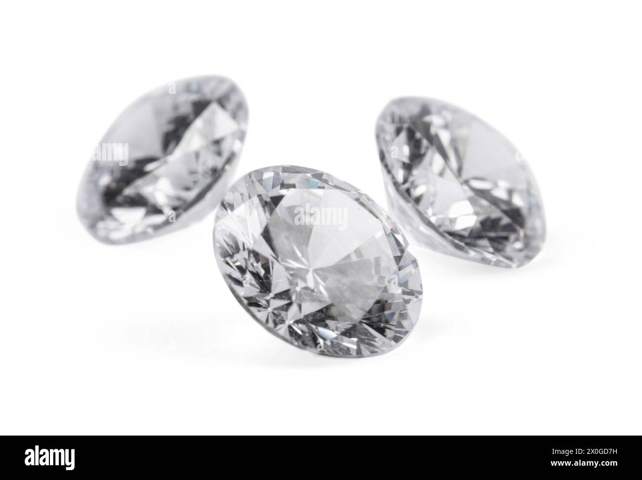 Three beautiful shiny diamonds isolated on white Stock Photo - Alamy