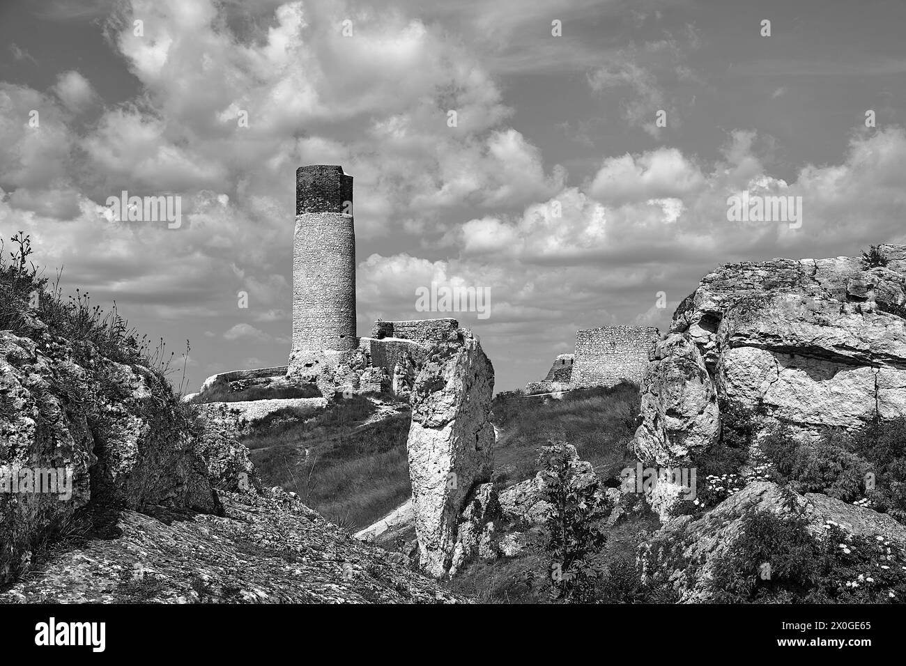 Limestone rocks and ruins of a medieval castle with a tower in Olsztyn ...