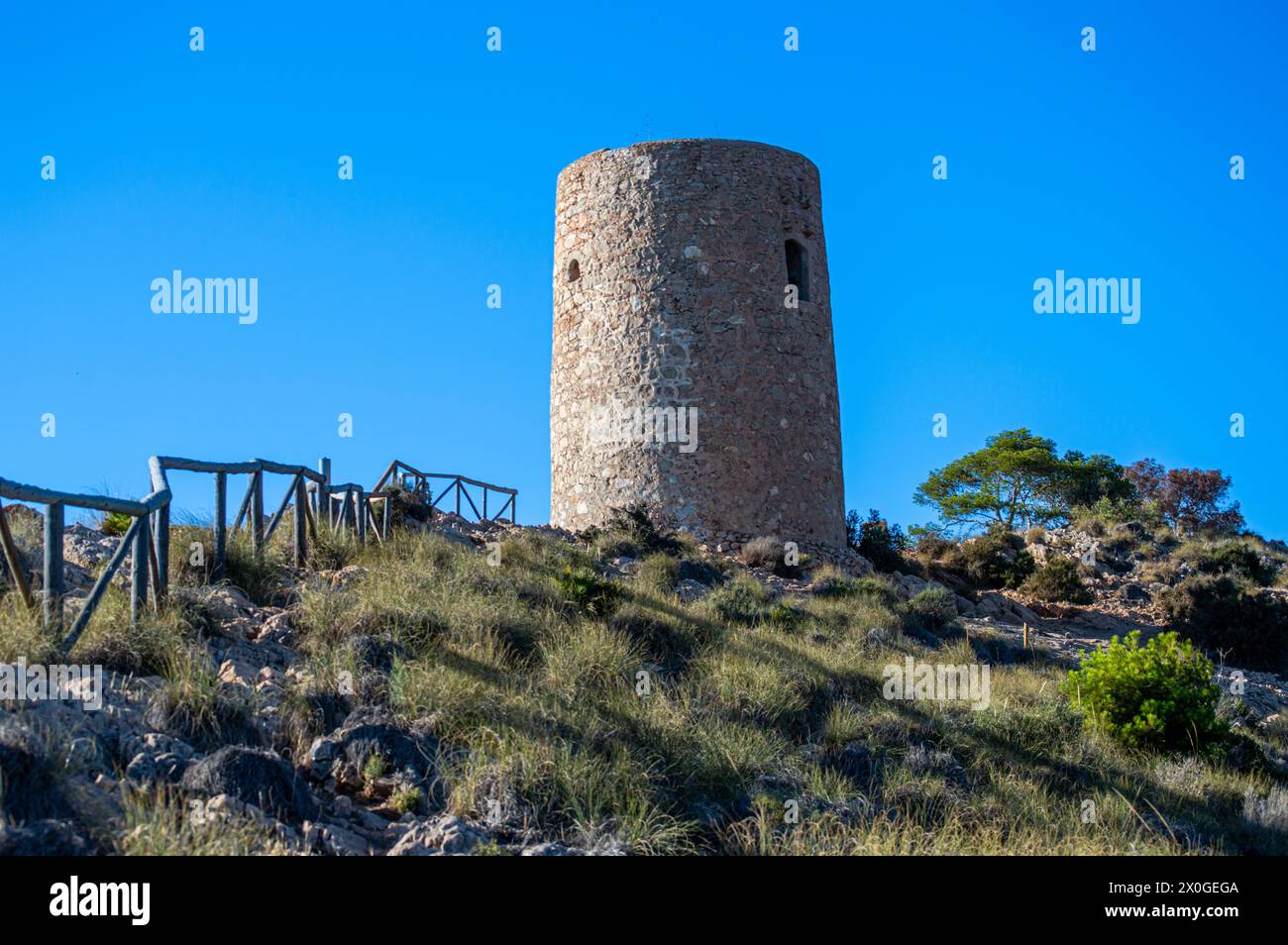 Mediterranean coastal landscape. Historic Torre Vigia De Cerro Gordo, a ...