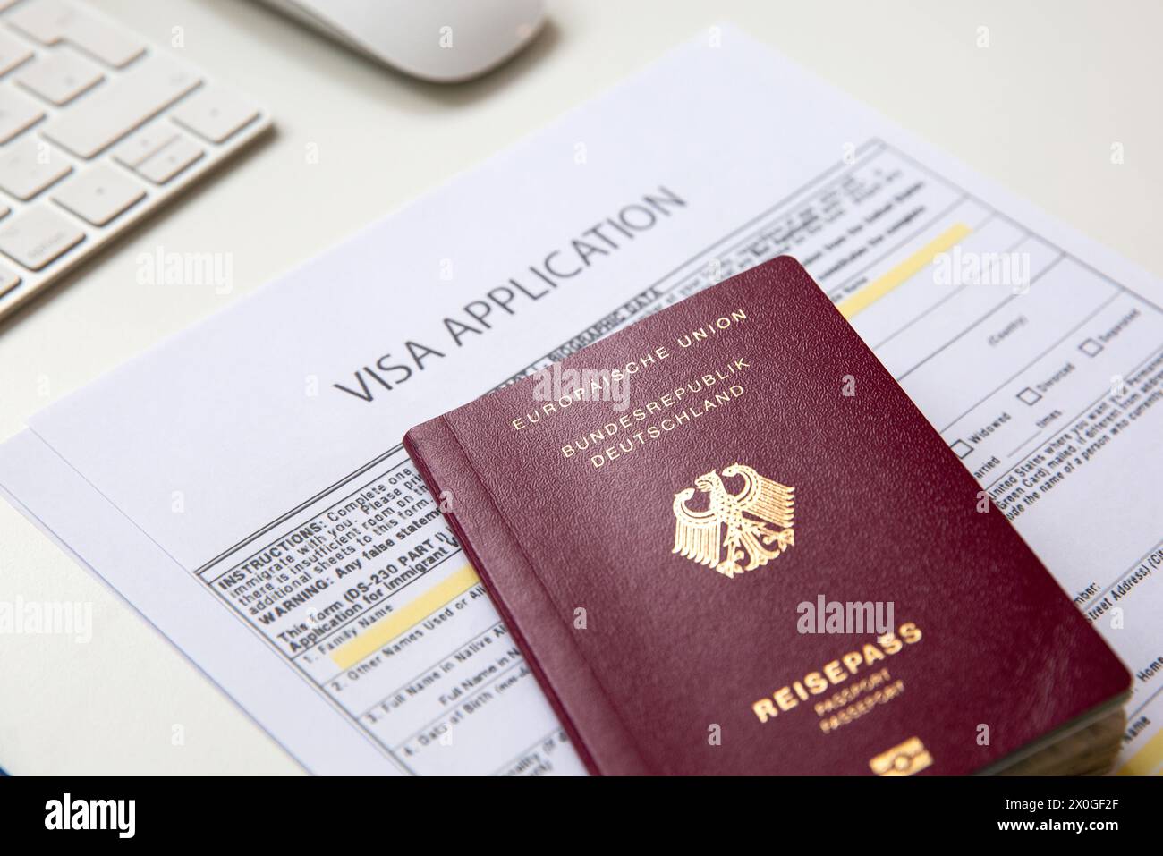 Top view of a visa application document with a German passport Stock ...