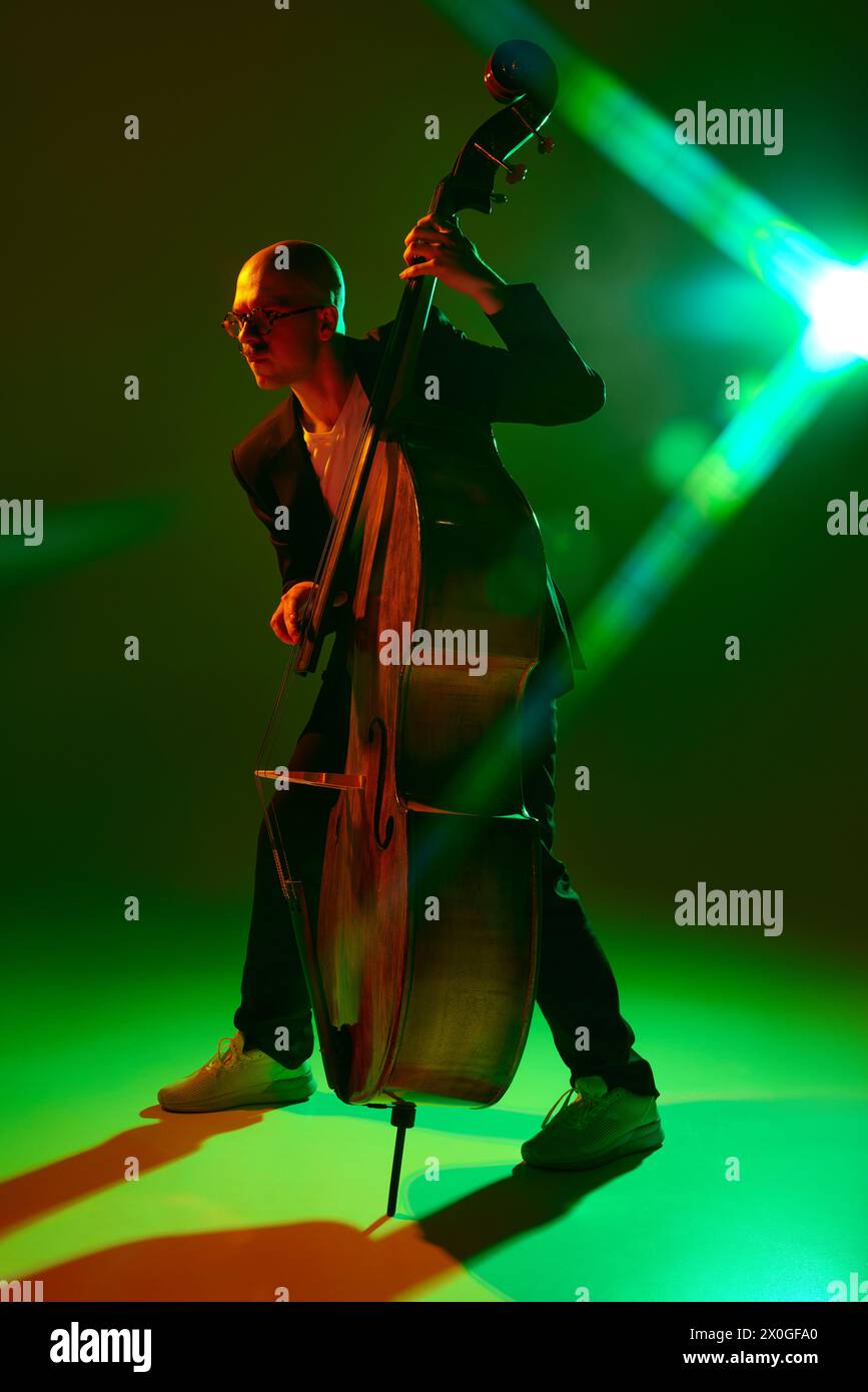 Double bass player performing contemporary jazz composition in red ...