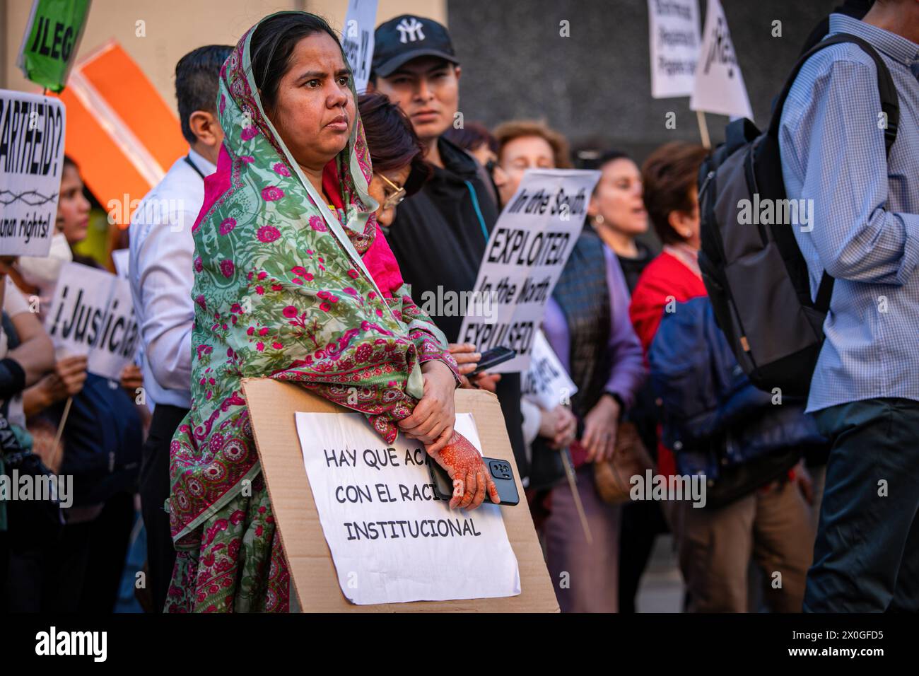 A protester holds a placard during a rally. Concentration in the Plaza ...