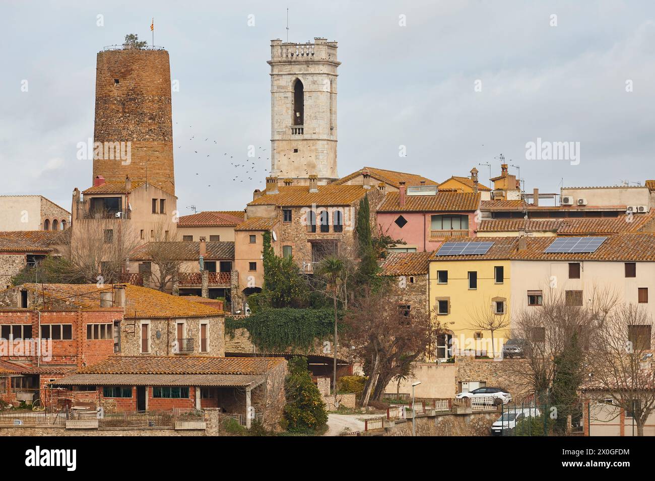 Traditional baix emporda village of Cruilles. Tower and church. Girona ...