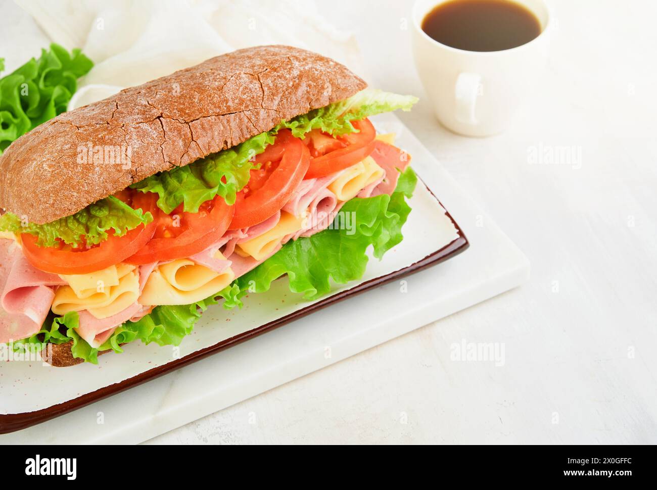 Sandwich. One fresh big submarine sandwich with ham, cheese, lettuce ...