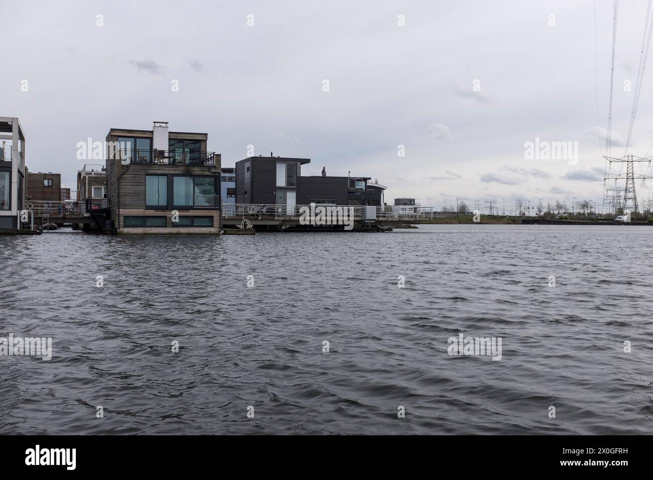 Floating homes and houses in the Waterbuurt (Water District) of Ijburg ...