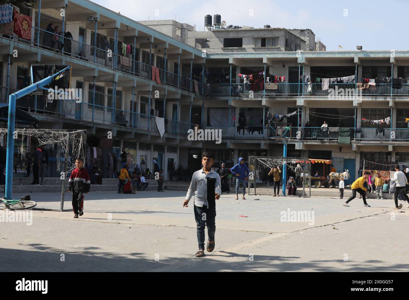 Palestinian residents of Al Nuseirat refugee camps evacuate during ...