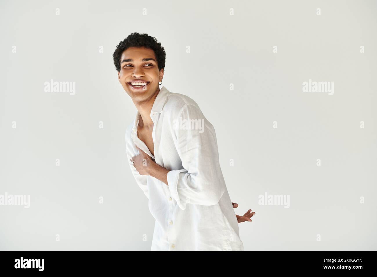 happy alluring african american male model in white linen attire ...