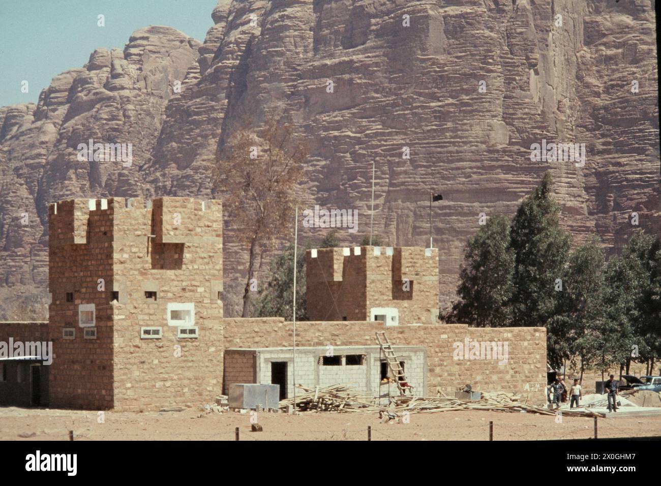 A Bedouin fort in front of a rock face in the valley of Wadi Rum ...