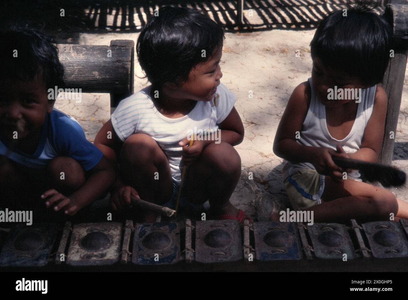 Children play with a xylophone in Yakan. [automated translation] Stock ...