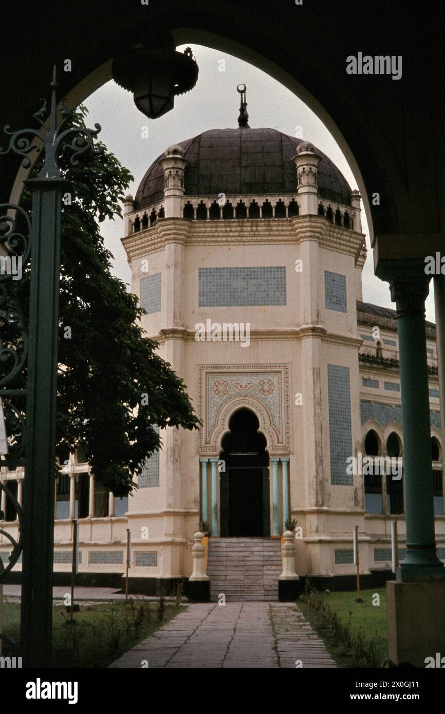 View through a gate to the entrance of the Mespid Raya Mosque in ...
